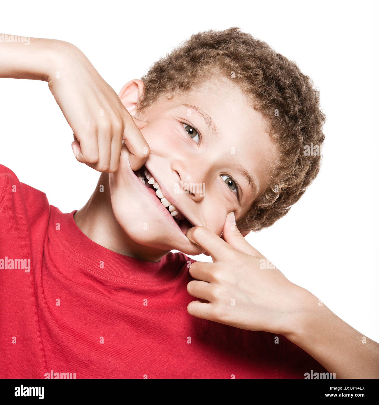 little caucasian boy portrait grimacing mischief isolated studio on ...