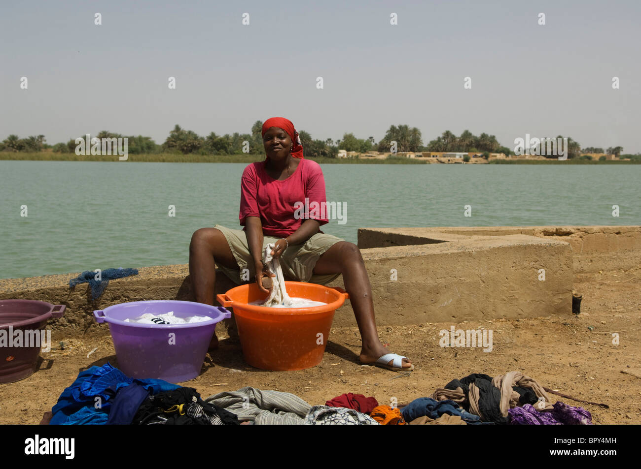 Woman washing clothes in the Senegal river, Dagana, Senegal Stock Photo ...