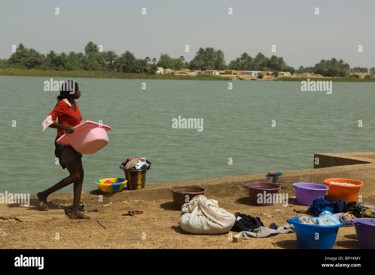 Woman washing clothes in the Senegal river, Dagana, Senegal Stock Photo ...
