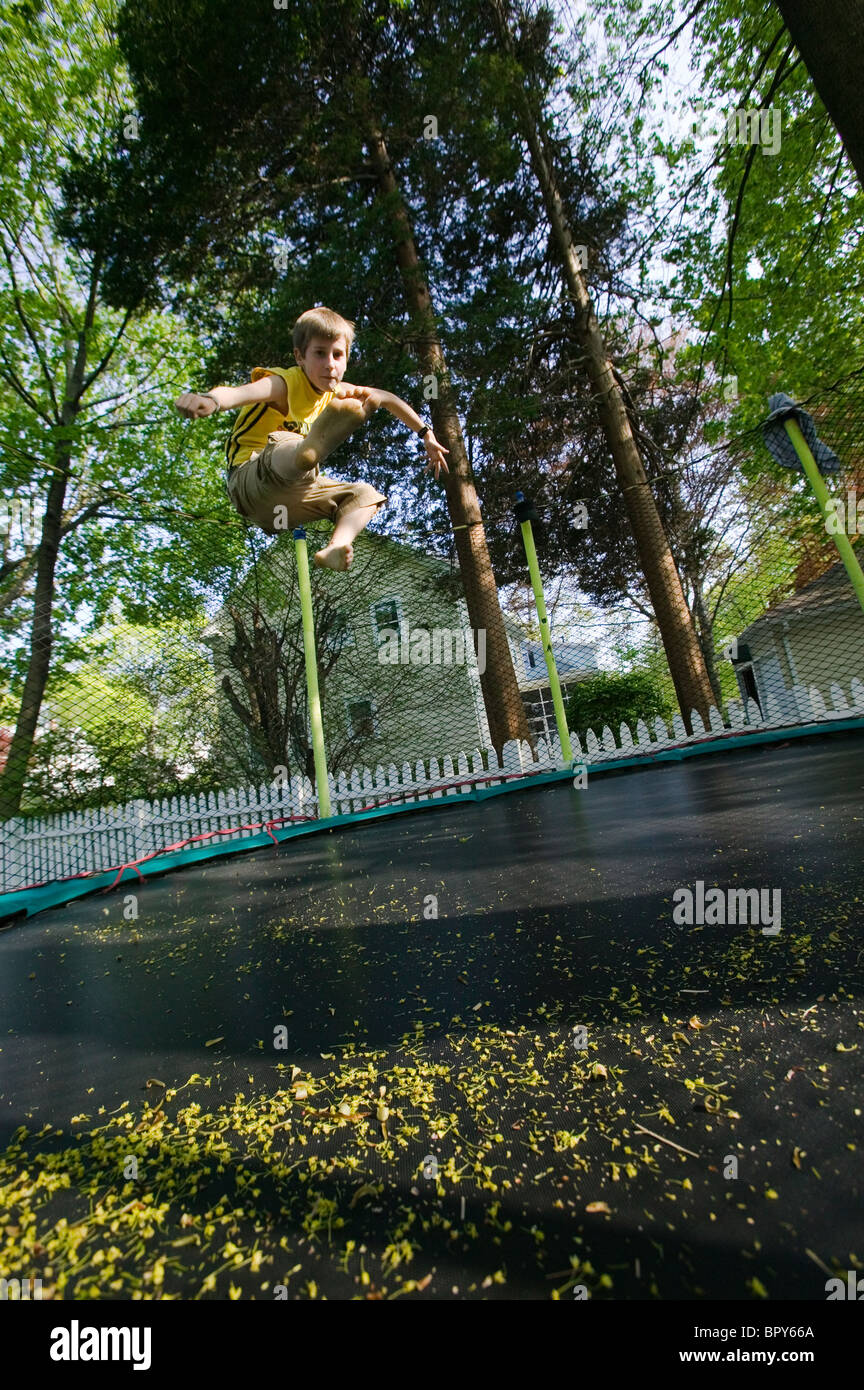Trampoline boy backyard hi-res stock photography and images - Alamy