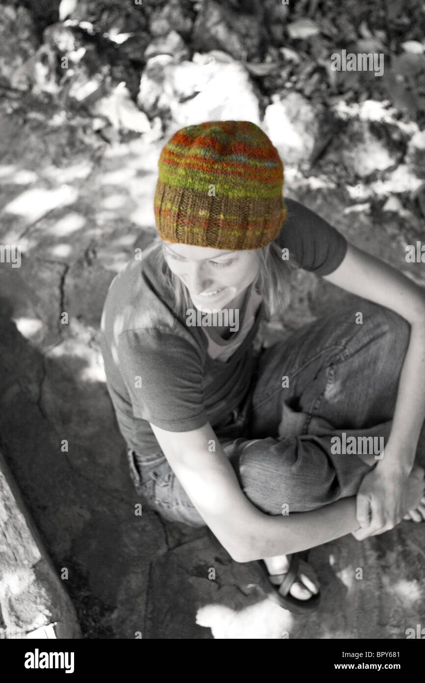 Woman sitting down outdoors (color tweaking done in photoshop Stock ...