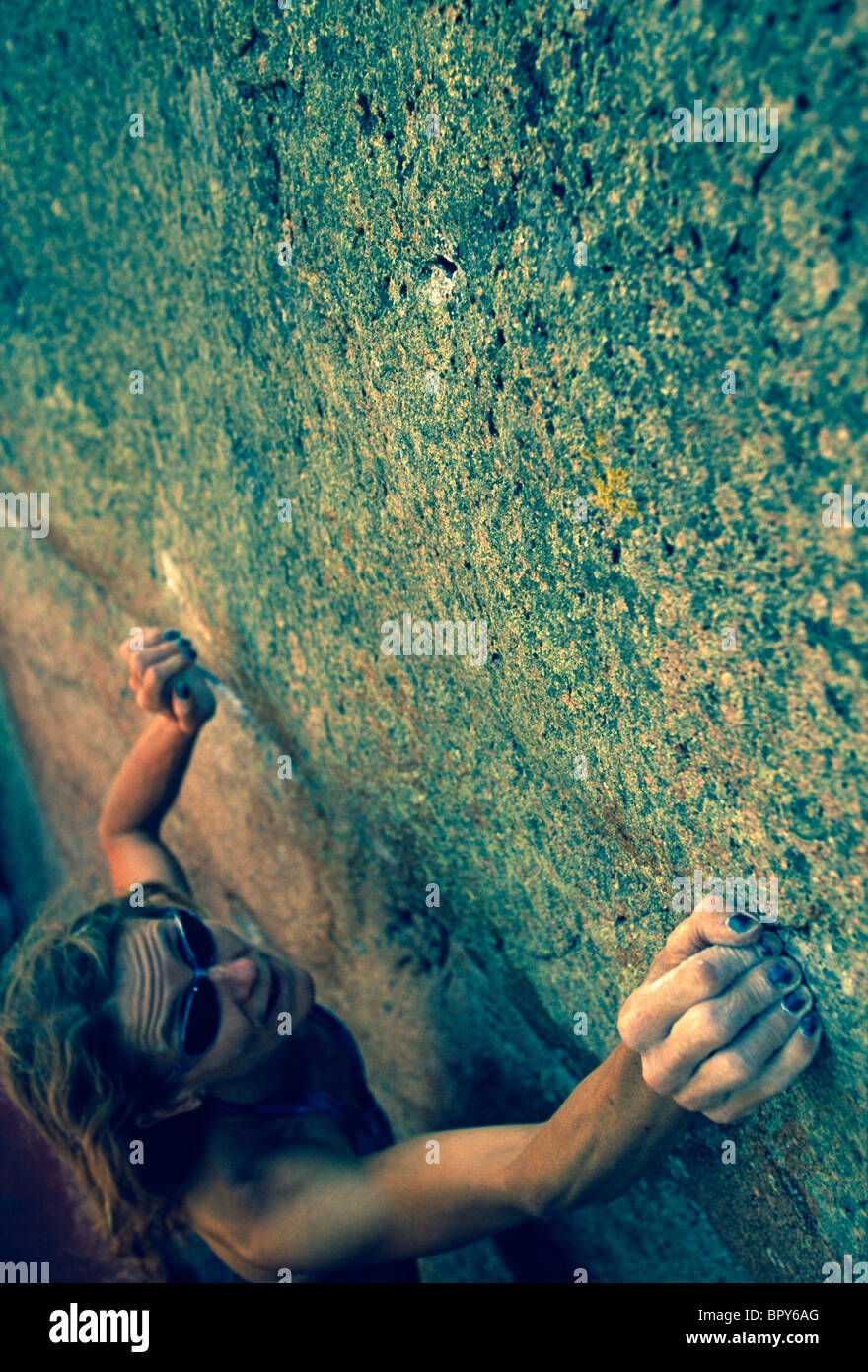 Woman rock climbing, Utah (cross processing effect applied in Photoshop ...