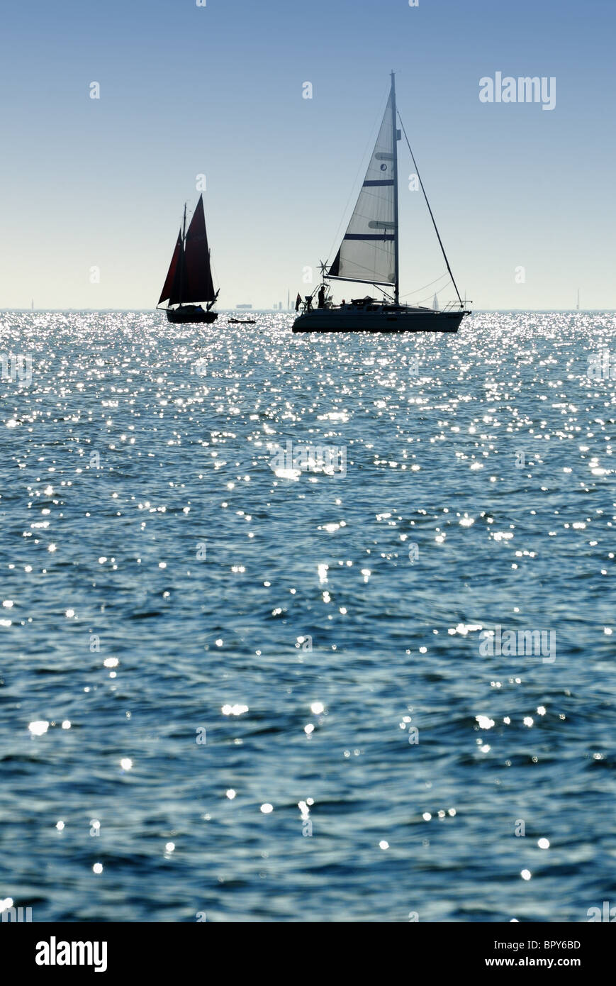 Yachts sailing on a deep blue sea Stock Photo - Alamy