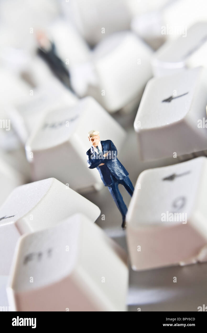 Business figurines placed with keys from a computer keyboard Stock ...