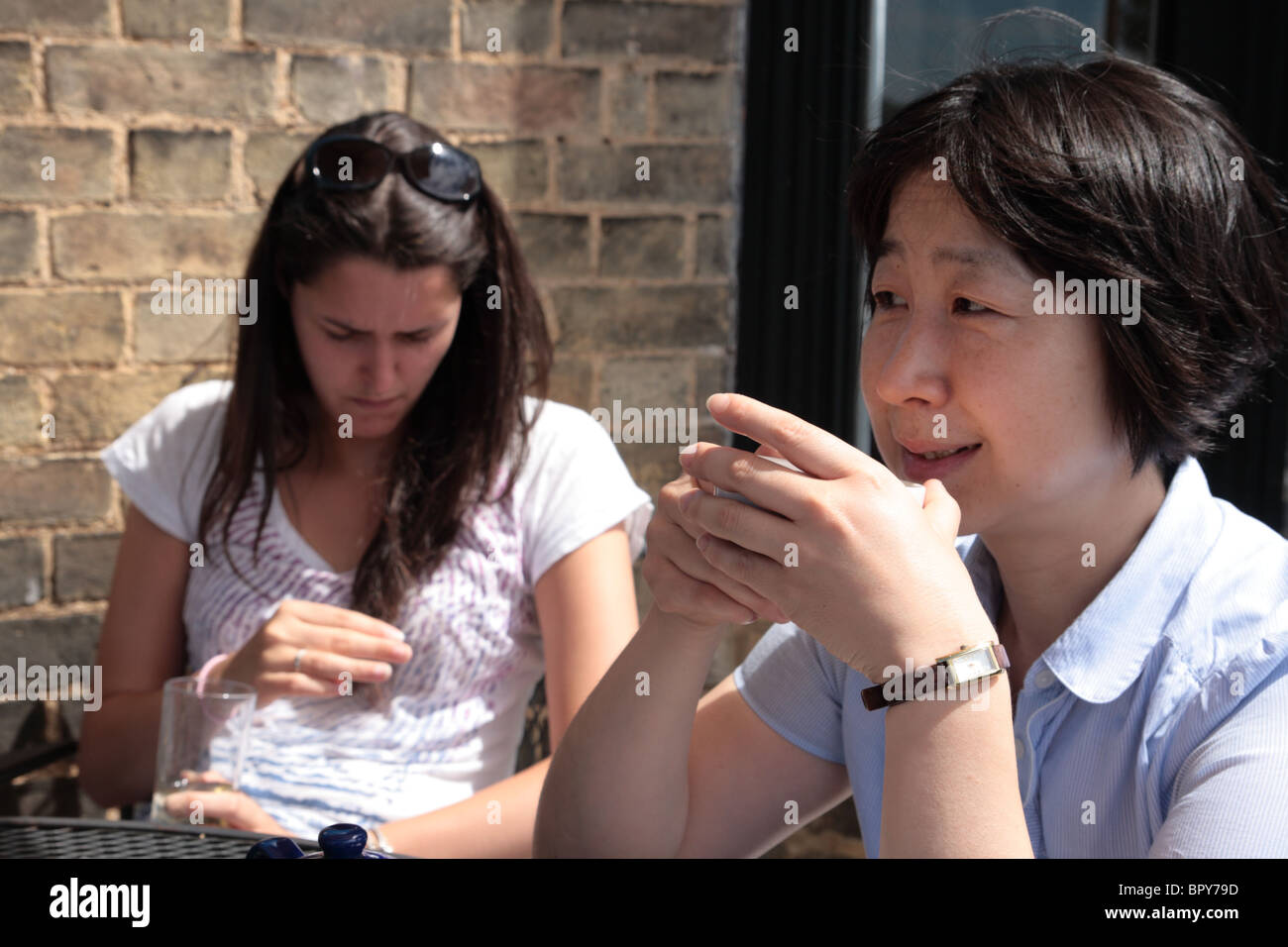 People enjoying afternoon tea outside hi-res stock photography and ...