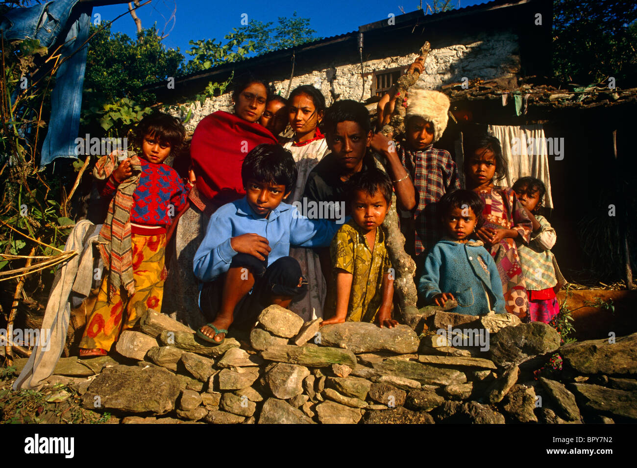 A Nepali family consisting of parents and young children are viewed ...