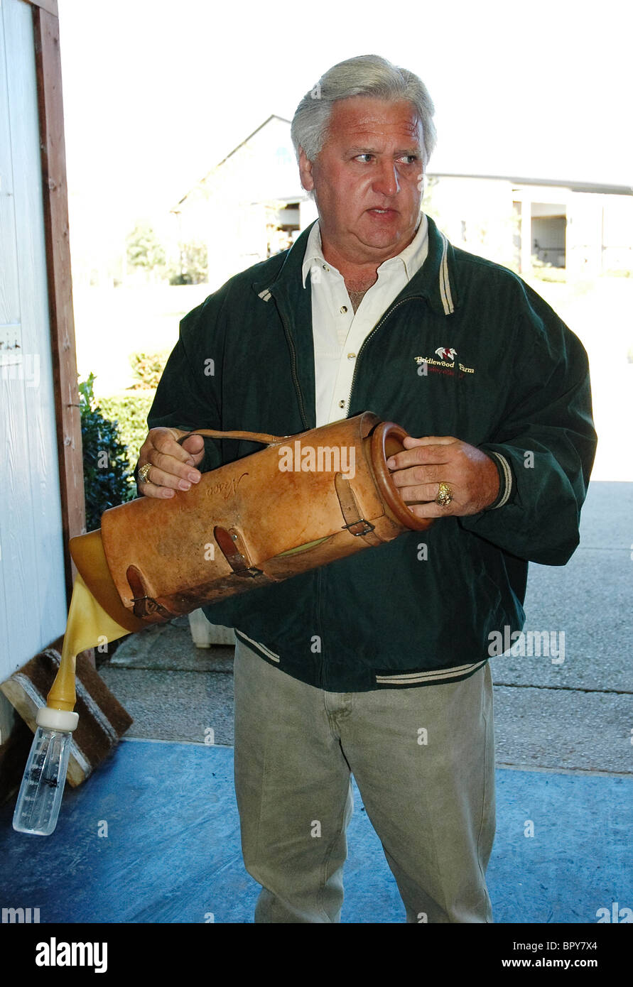 Larry Lowman holds an artificial vagina for gathering semen in the ...