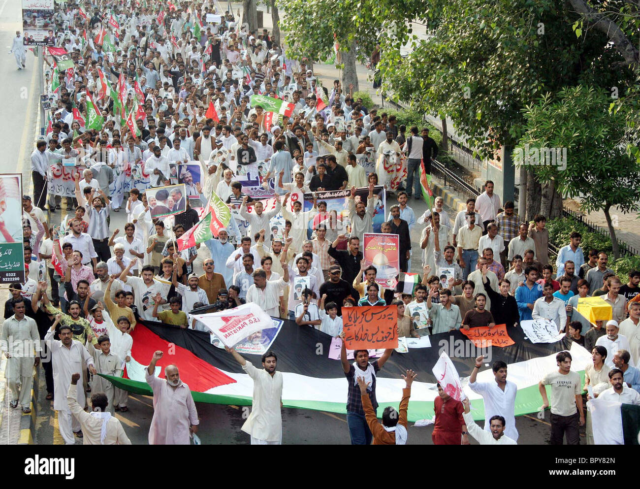 Supporters of Imamia Students Organization (ISO) pass through Mall road ...