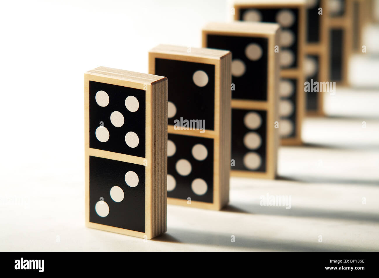 Line of domino tiles Stock Photo - Alamy