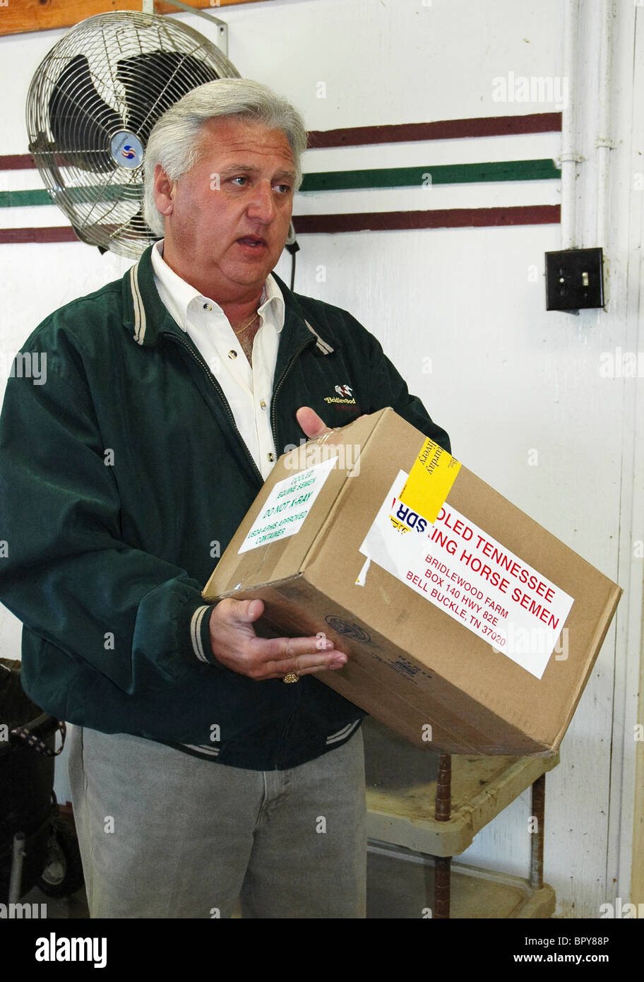 Larry Lowman holds box of Tennessee Walking Horse semen ready to be ...