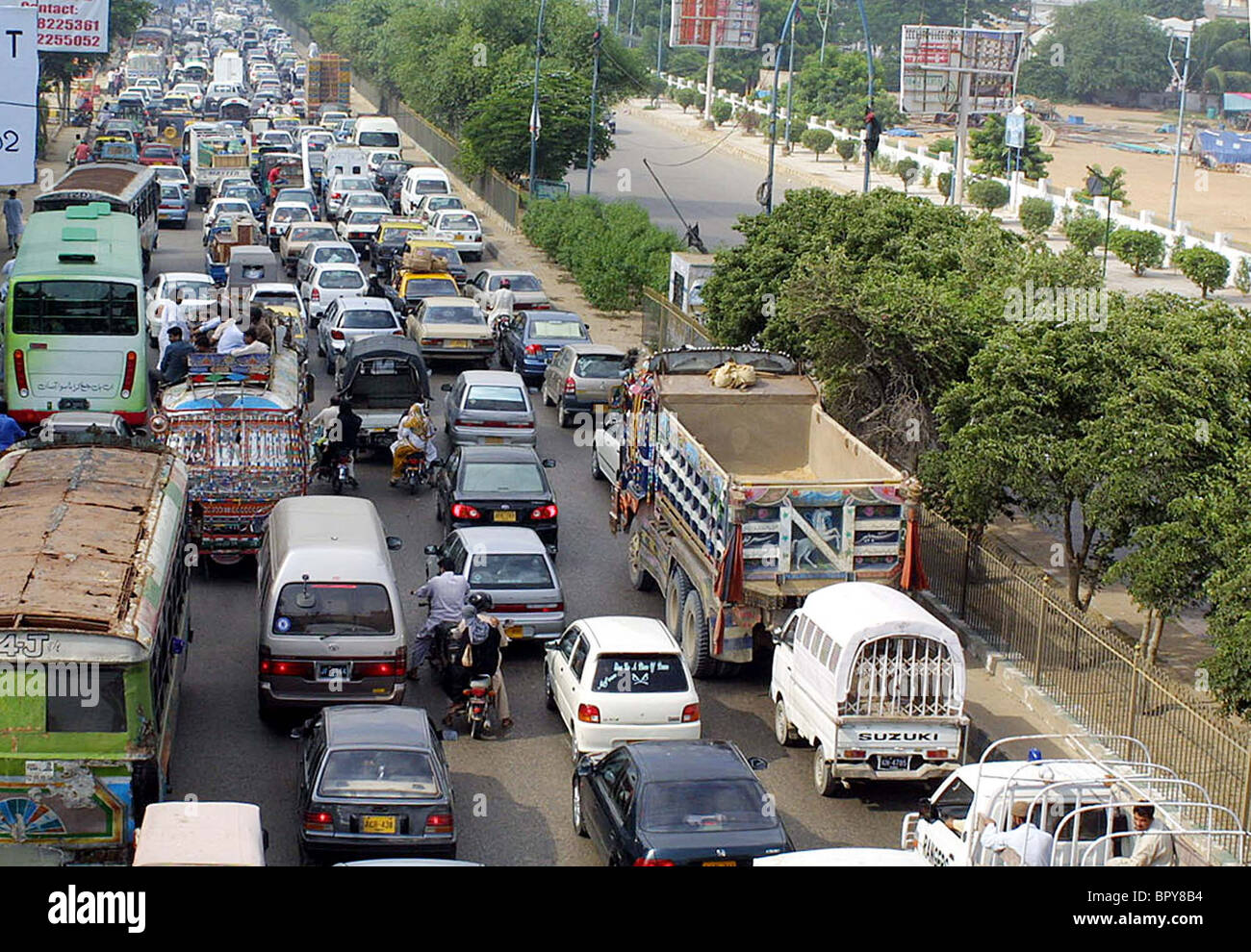 A long queue of vehicles stuck in traffic jam at a road at Nazimabad ...