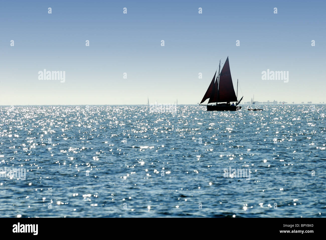 Yachts sailing on a deep blue sea Stock Photo - Alamy