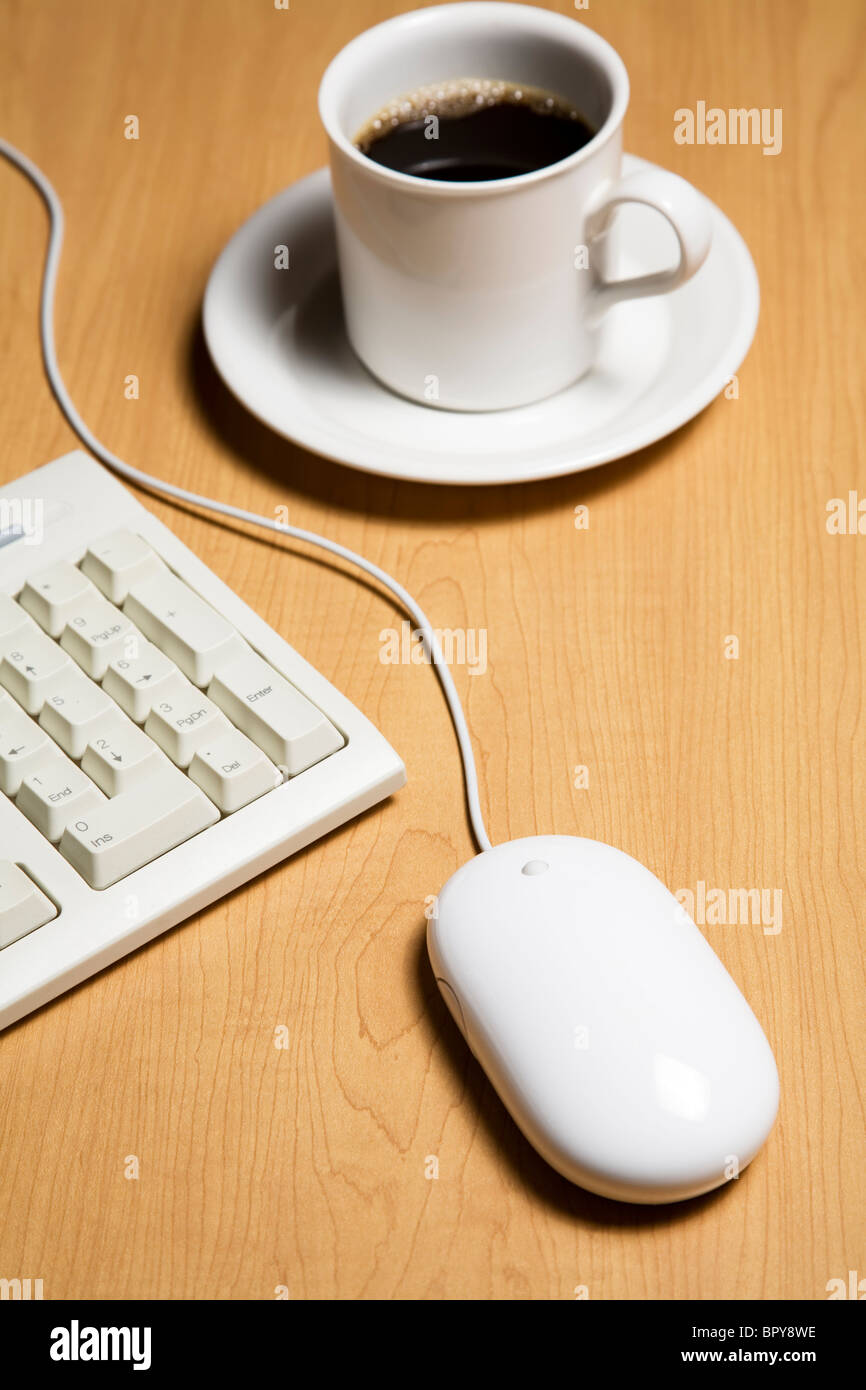 Computer mouse, computer keyboard, and cup of coffee Stock Photo - Alamy