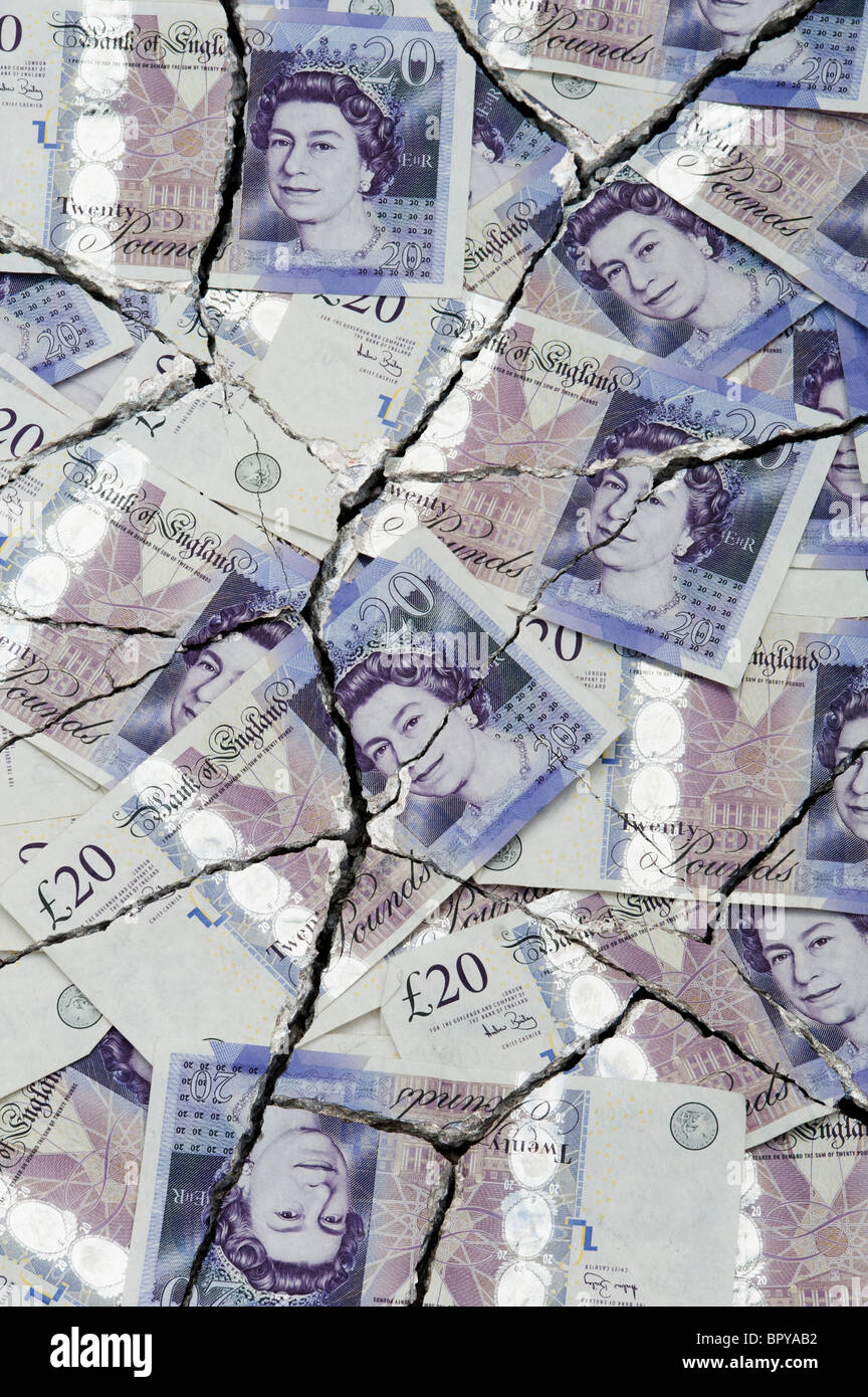 Cracked Twenty pound notes concept to represent an economic crisis ...