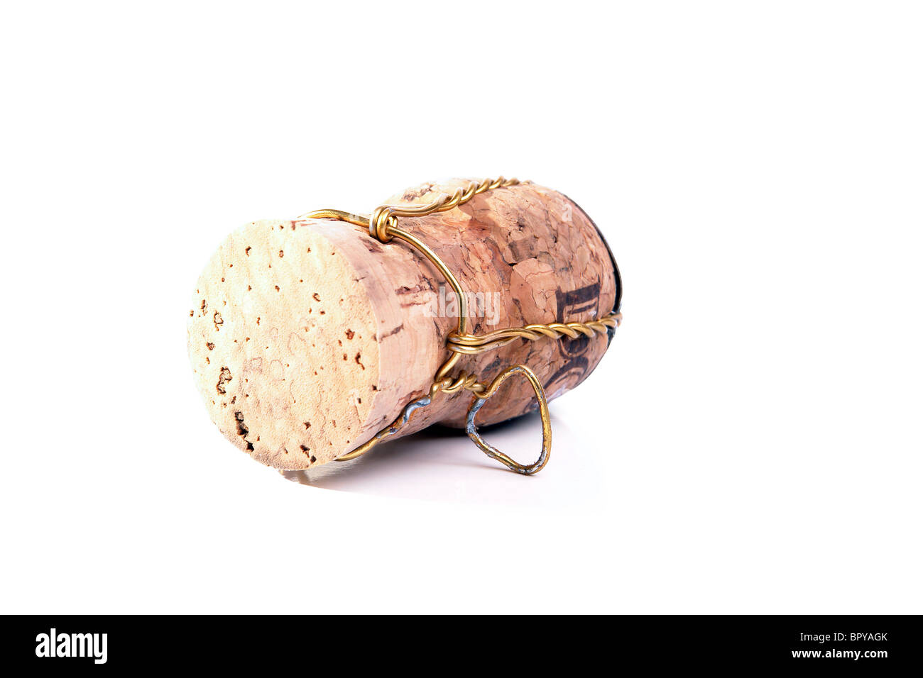 Champaign cork with golden metal wire over white background Stock Photo ...