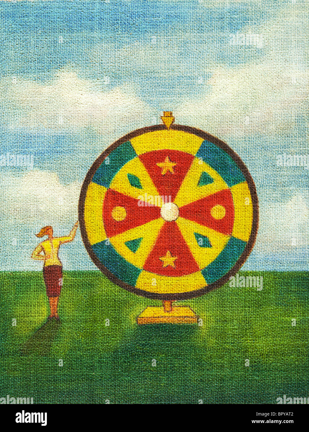 A woman standing beside a spinning wheel Stock Photo - Alamy