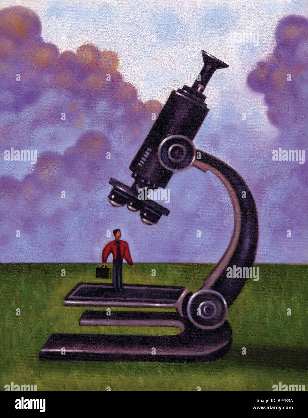 Businessman standing underneath a microscope Stock Photo - Alamy