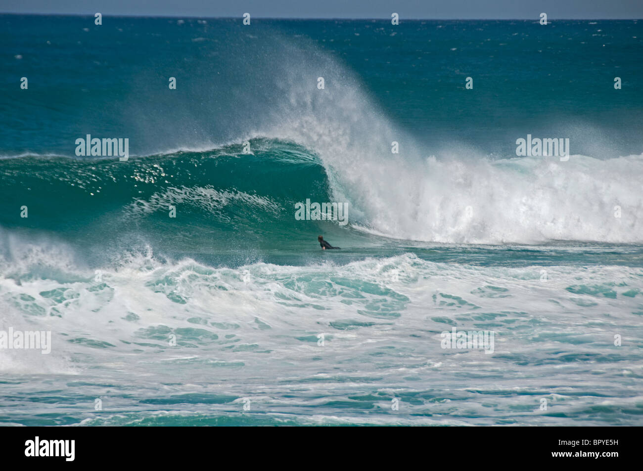 Big tubed wave with a surfer watching. on Stradbroke Island Stock Photo ...