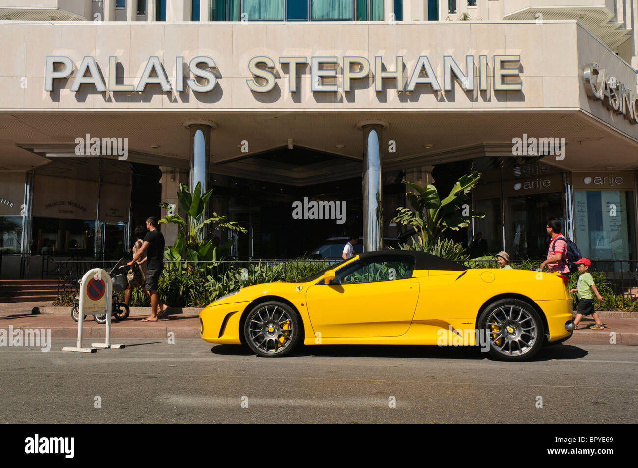 Yellow Ferrari 450 parked outside the Palais Stephanie Casino, Cannes ...