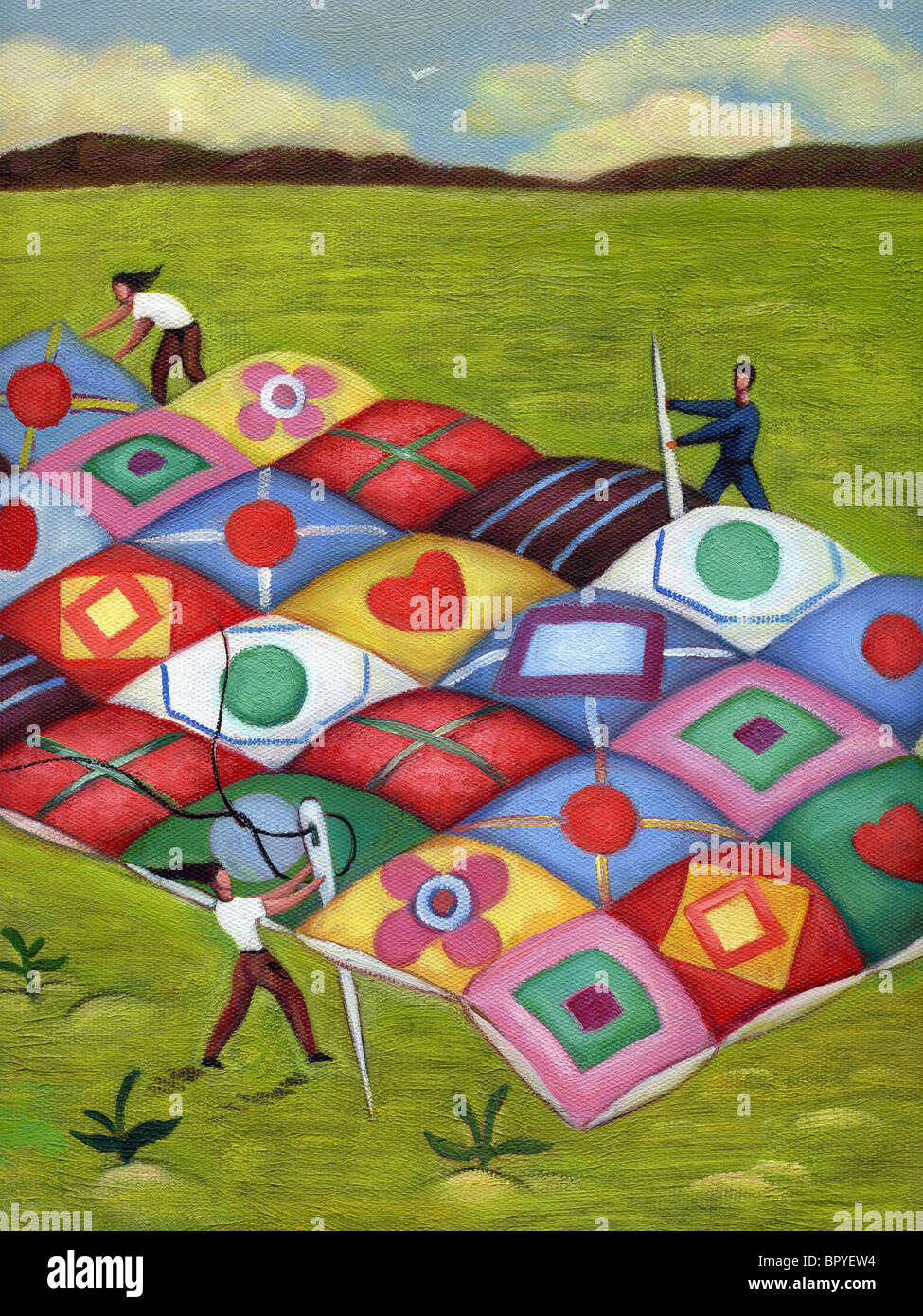 People sewing a large quilt together Stock Photo - Alamy