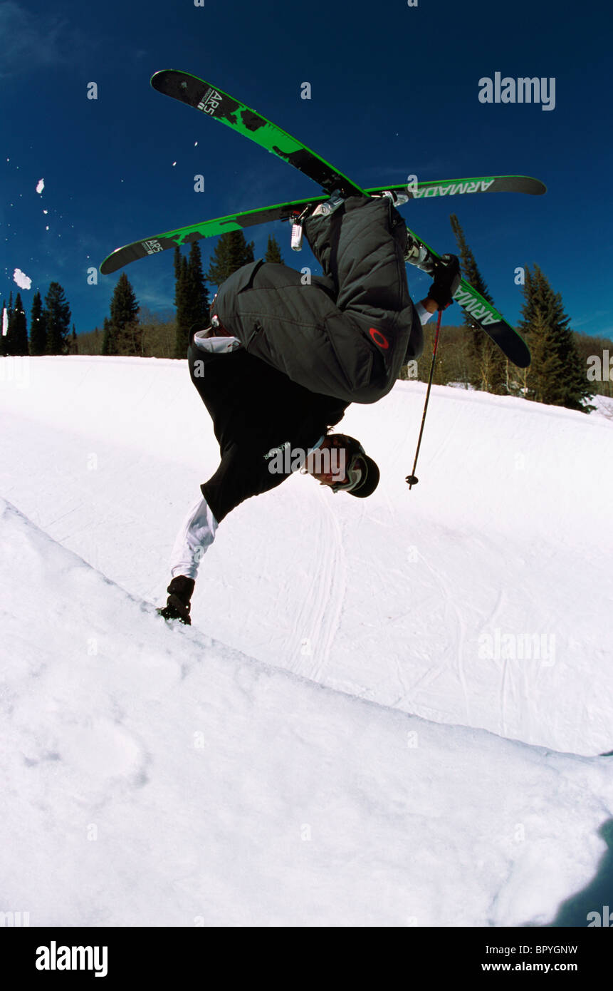 skier performs hand plant in half pipe Stock Photo - Alamy