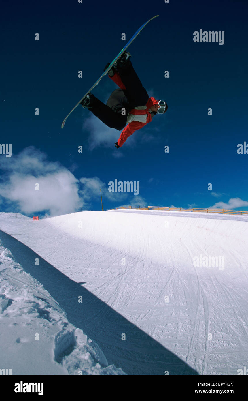 Snowboarder catches air in the half pipe Stock Photo - Alamy