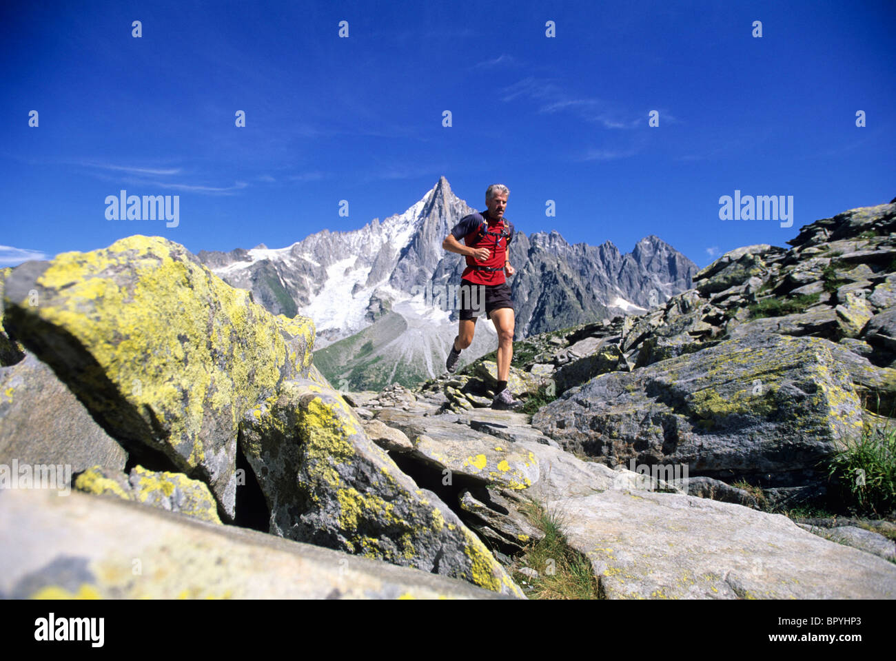A man trail runs in Chamonix, France Stock Photo - Alamy