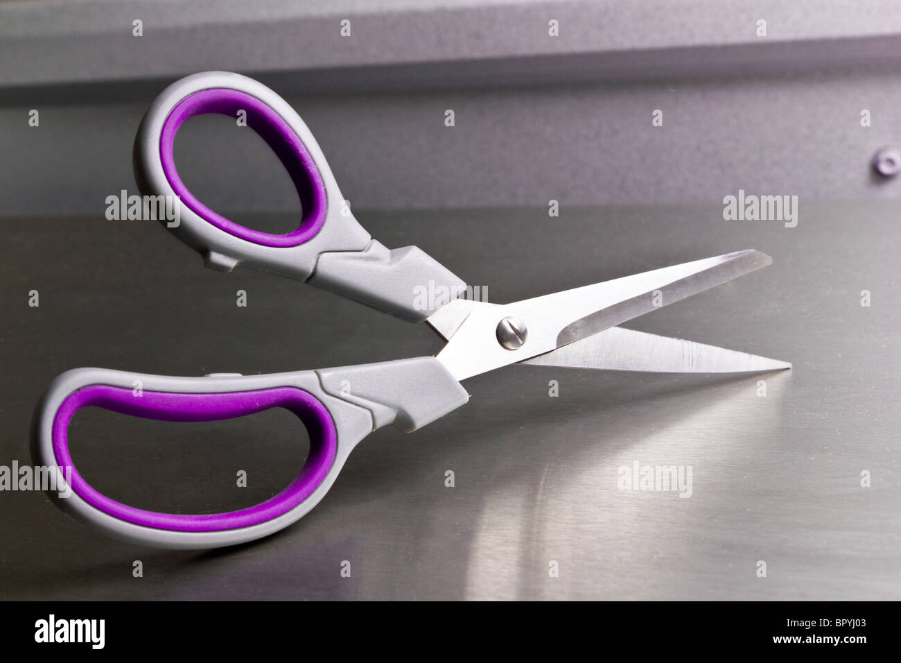 Scissors on stainless steel table Stock Photo - Alamy