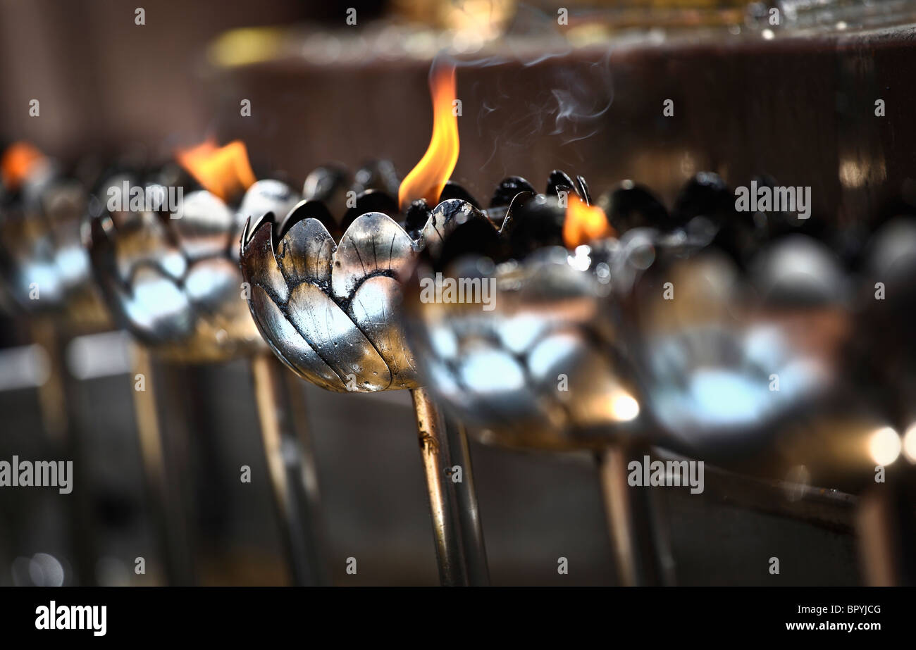 fire lamp flower shape in thai temple Stock Photo - Alamy