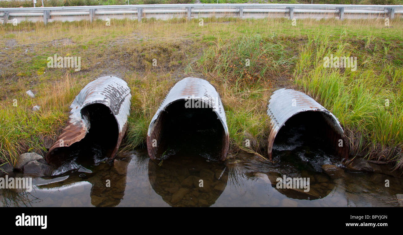 Entry of water into three culverts side by side Stock Photo - Alamy