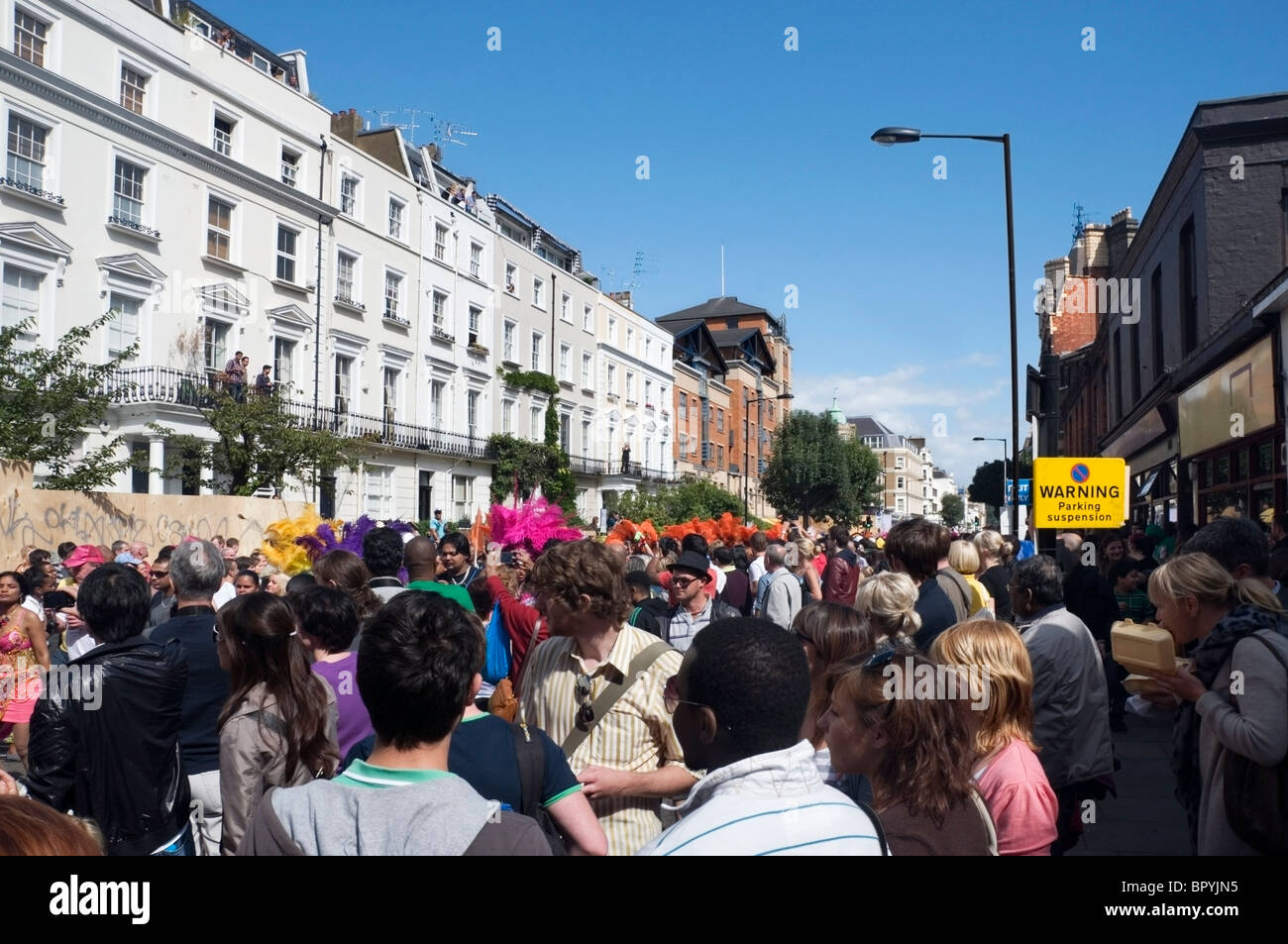 Dense Westbourne street with people, crowds and performers parade at ...