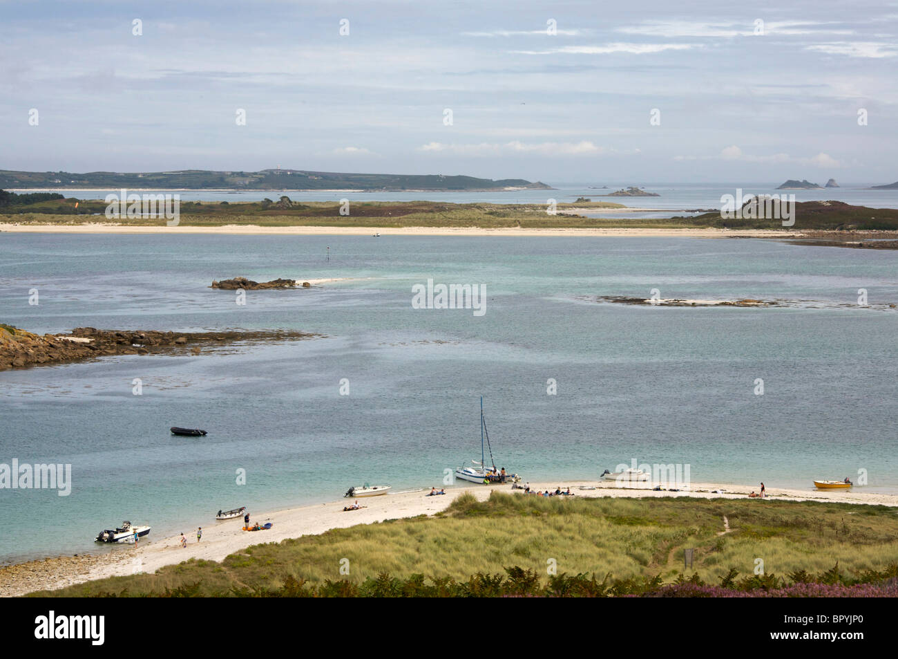 Daytrippers moor their boats on the beach on the Uninhabited Isle of ...