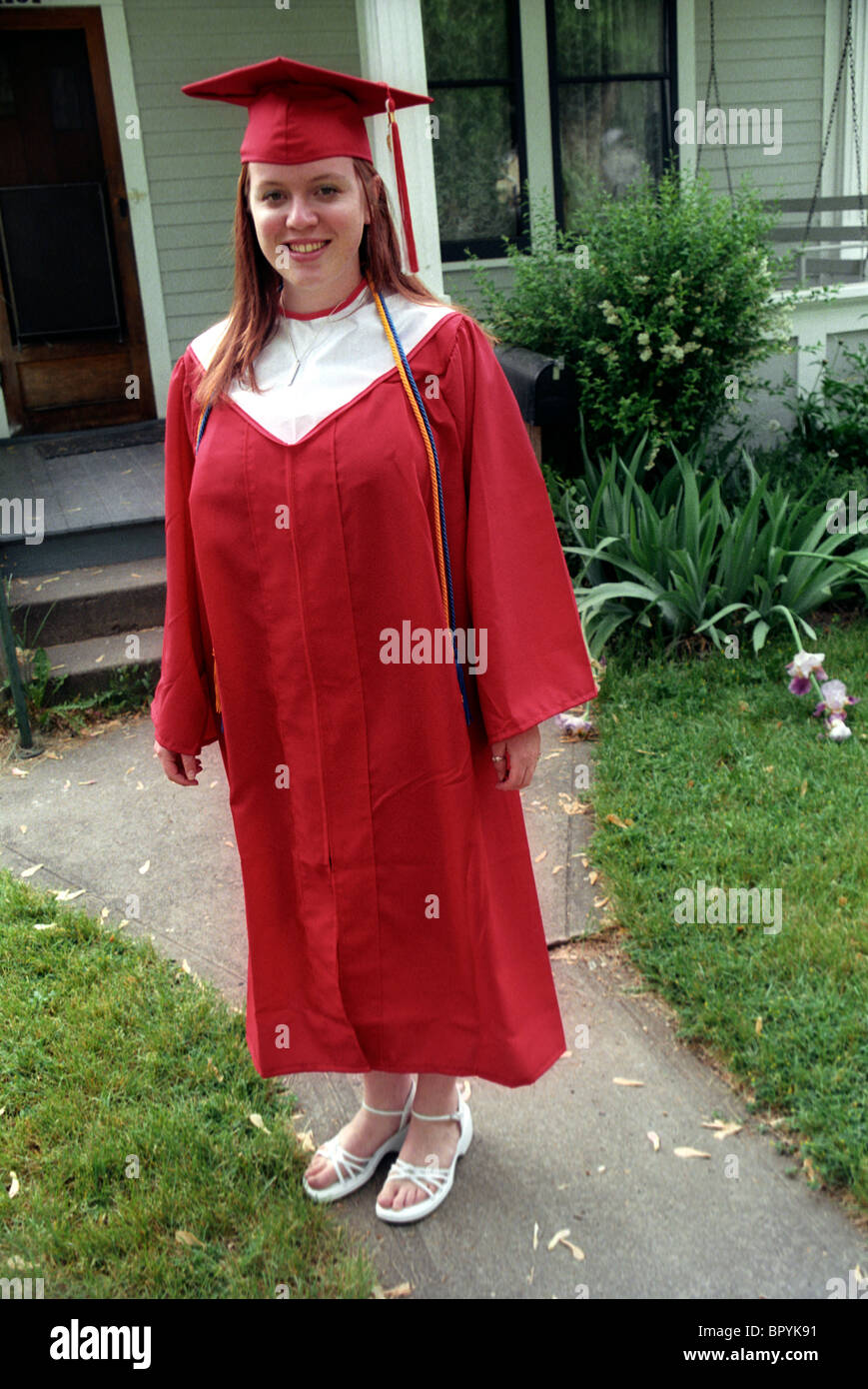 A graduate at Durango High school in Durango, Colorado poses in front ...