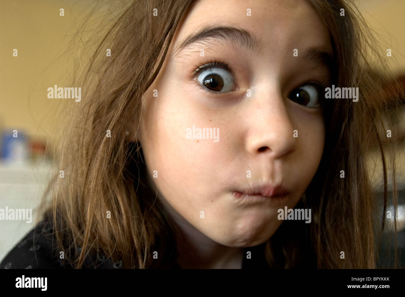 A young girl makes a silly face Stock Photo - Alamy