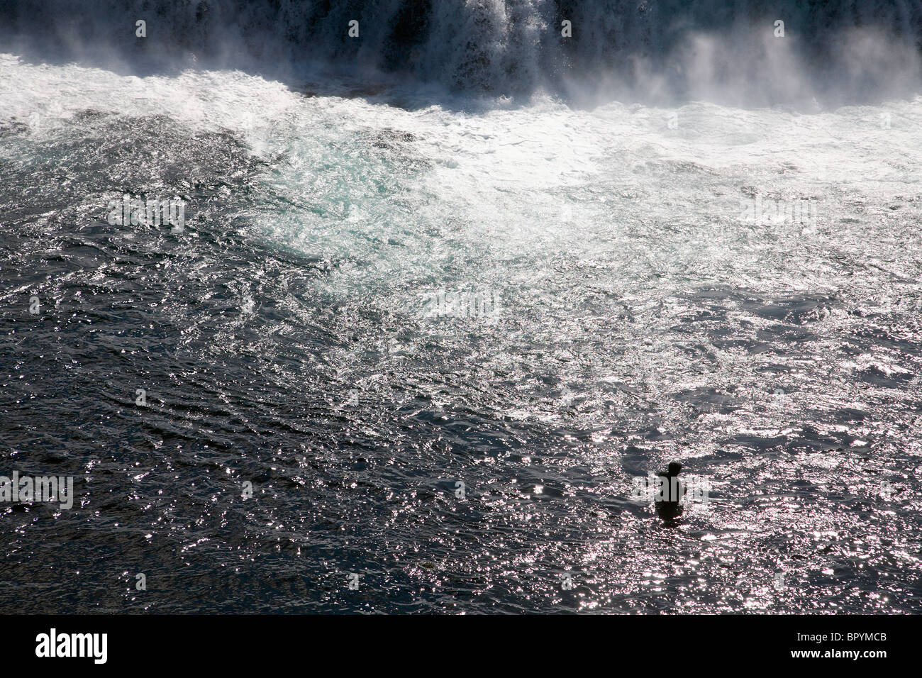 Fishing at waterfall Iceland Stock Photo - Alamy