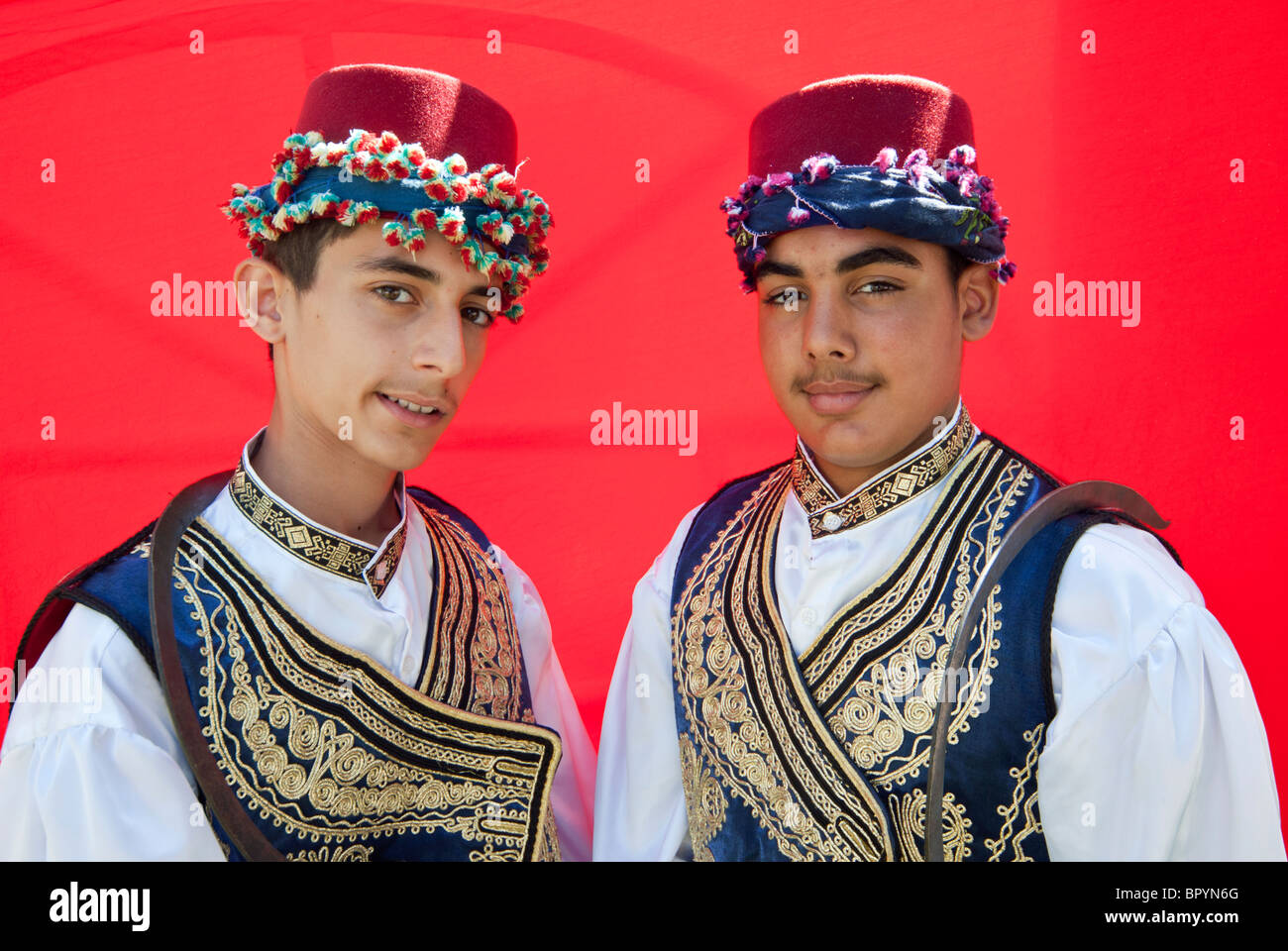 TWO TURKISH TEENAGER IN TRADITIONAL FOLCLORIC DRESS BEFORE THE ...