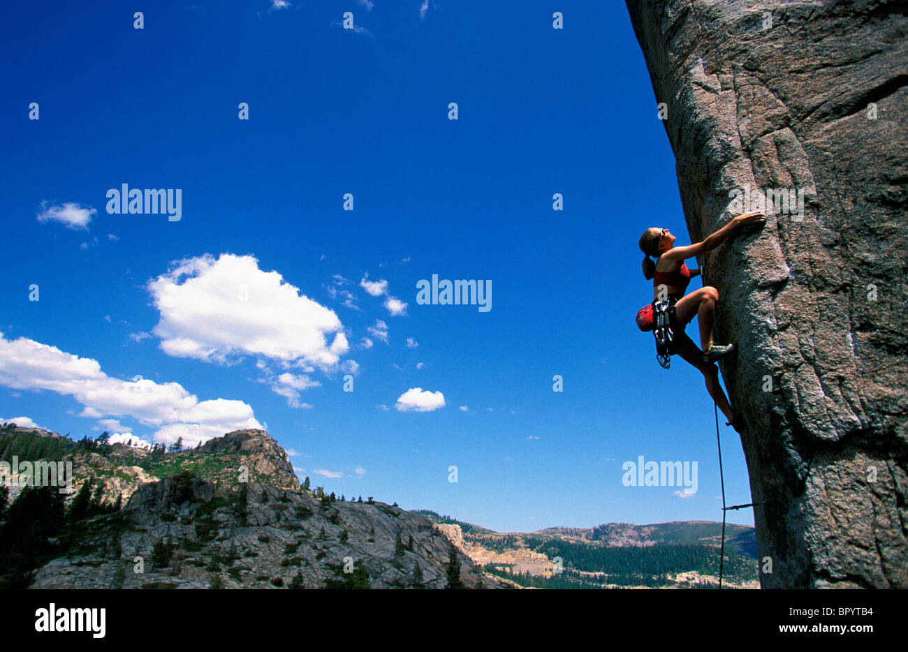 A woman lead climbing Stock Photo - Alamy