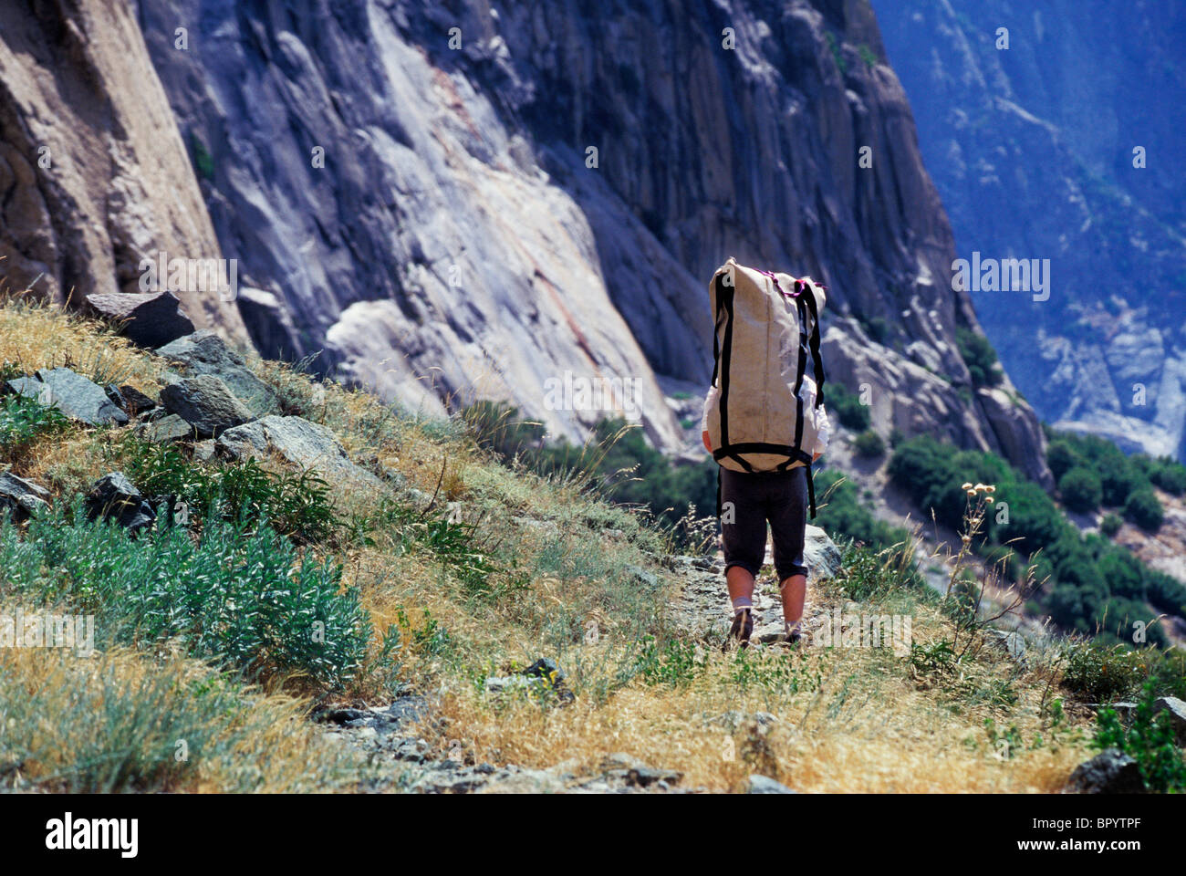 A man approaches a climbing route Stock Photo - Alamy
