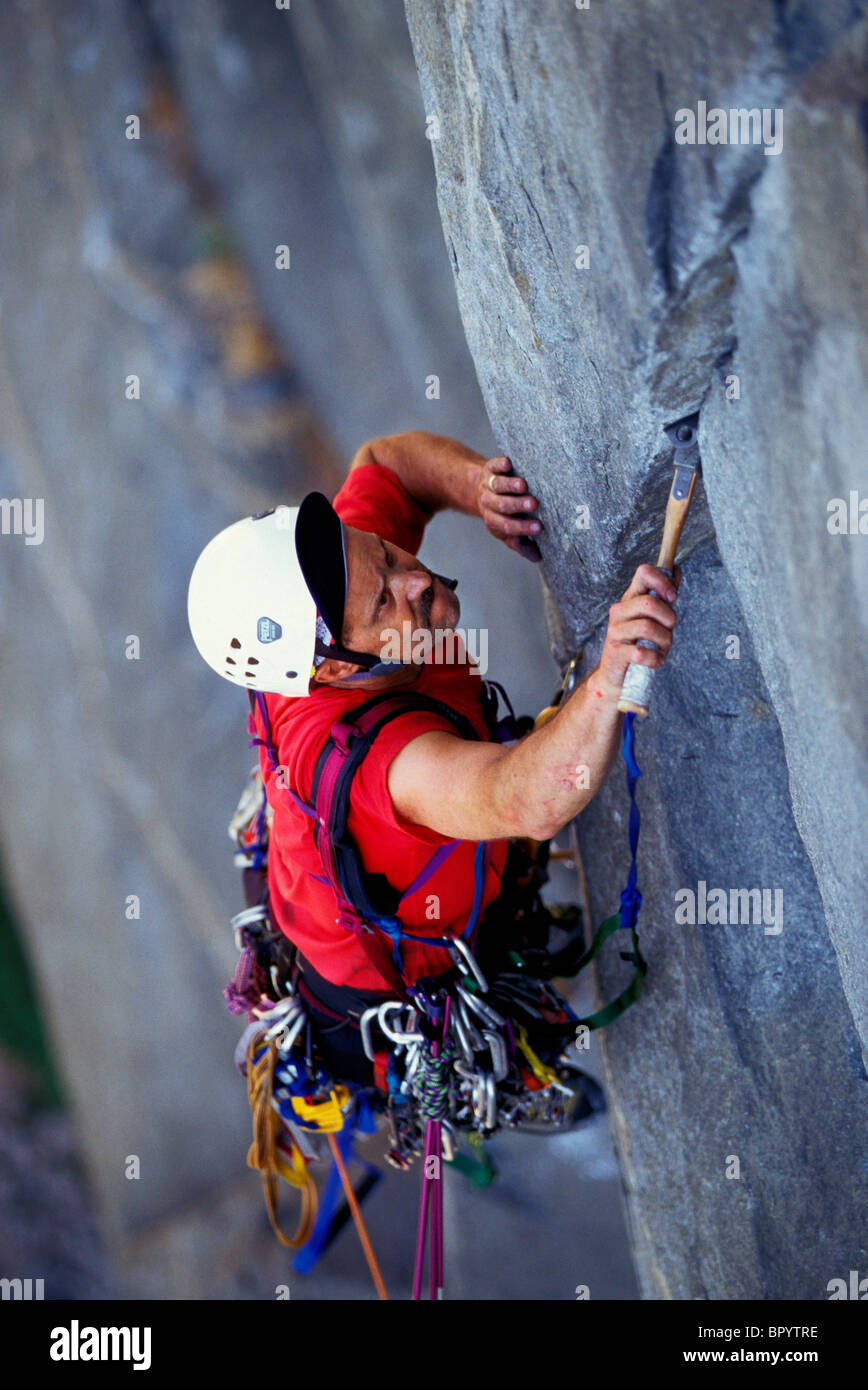 A man works his way up a long aid climb Stock Photo - Alamy