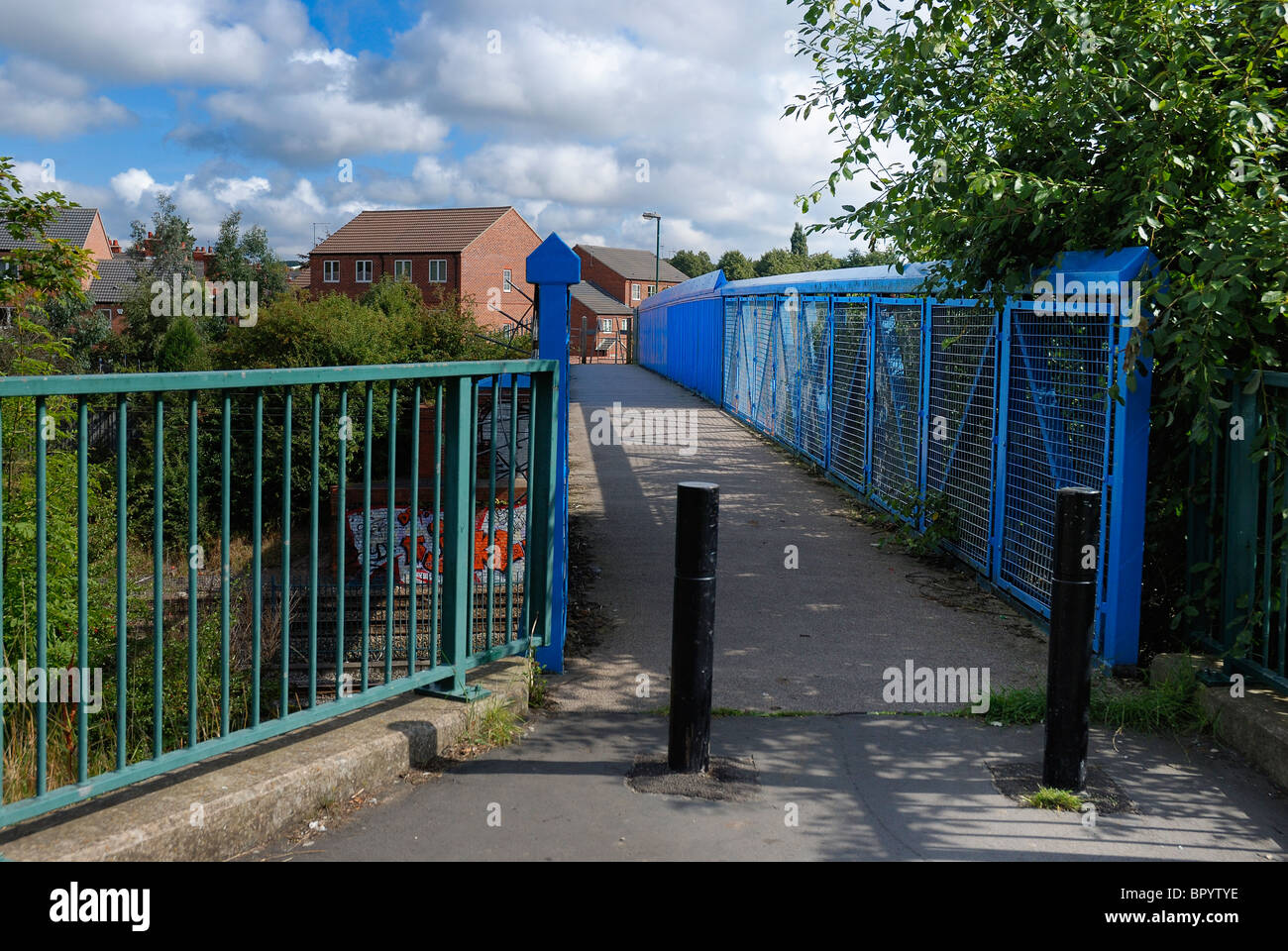 local pedestrian walkway bridge over railway and tram lines Stock Photo ...