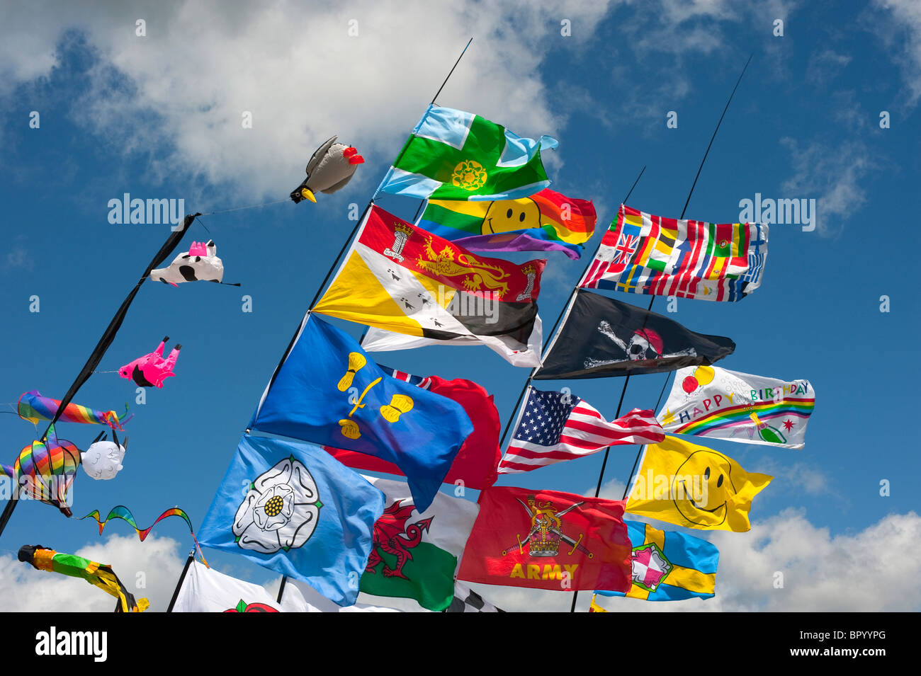 Bright colourful fun flags blue sky bold Stock Photo - Alamy