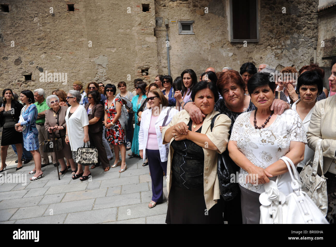 a big crowd of people gathering to watch the procession Stock Photo - Alamy