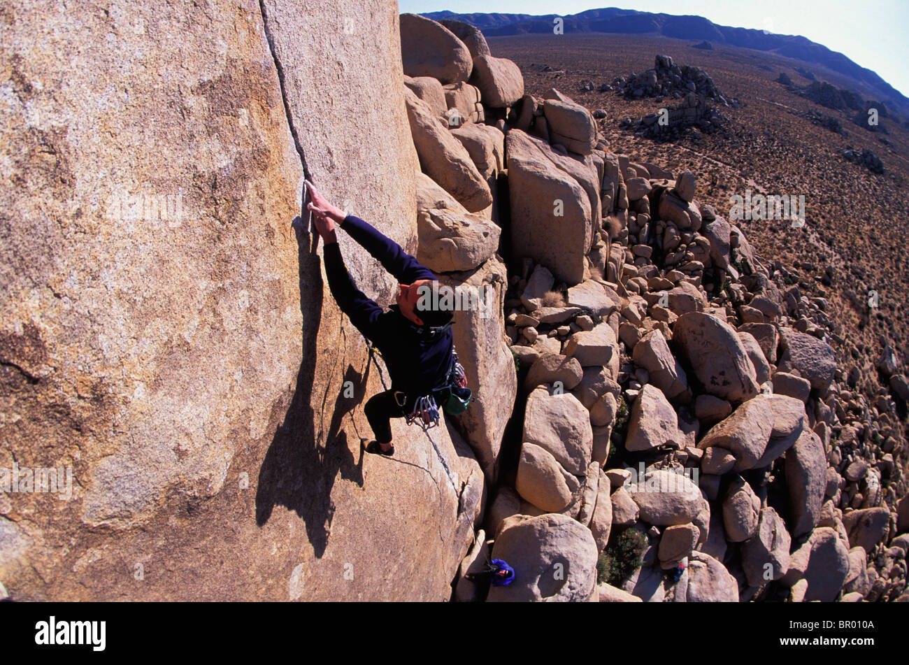 A man lead climbing in the desert Stock Photo - Alamy