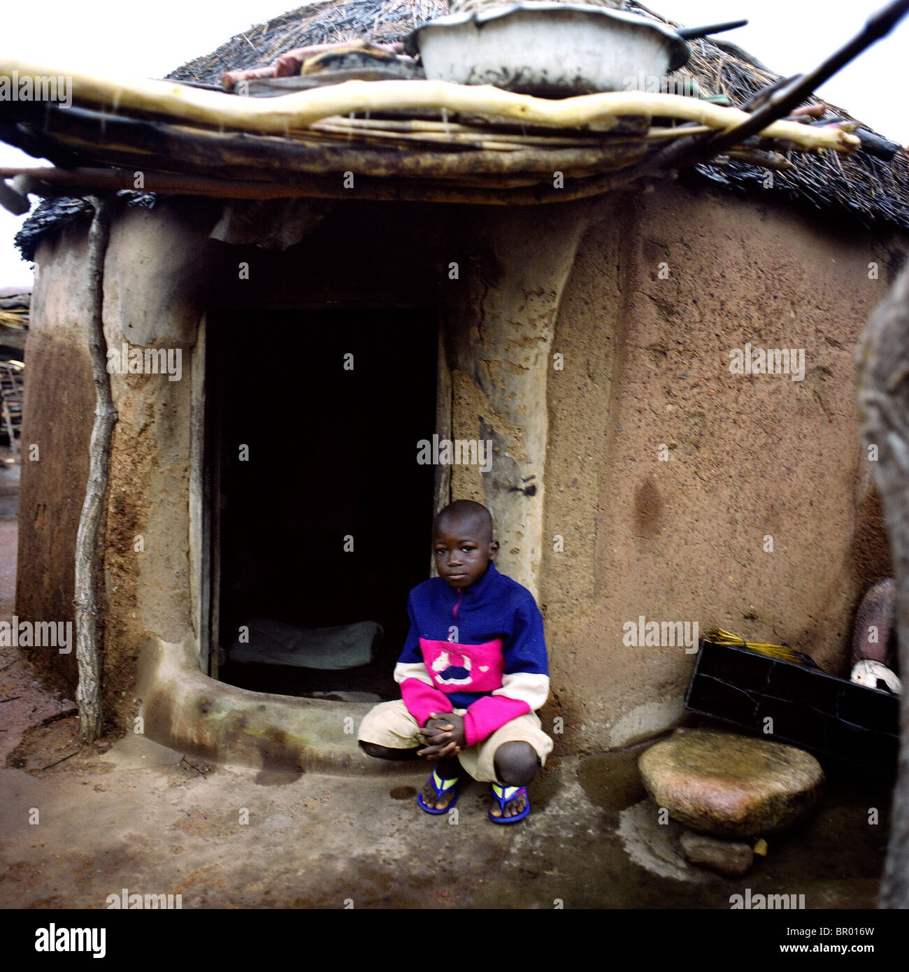 A little boy in front of his hut Stock Photo - Alamy