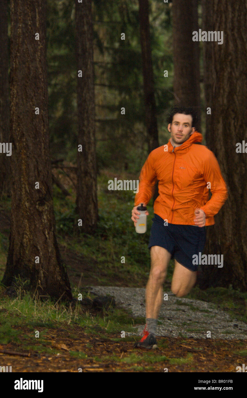 A man running on a trail in Golden Gardens, Seattle Stock Photo - Alamy