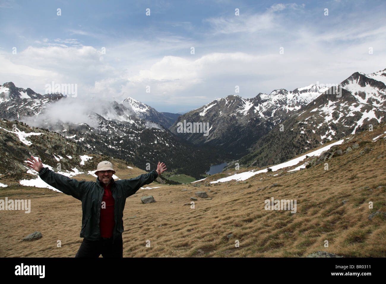 Crazy climber screaming at Estany Llong view from top of Portarro d ...