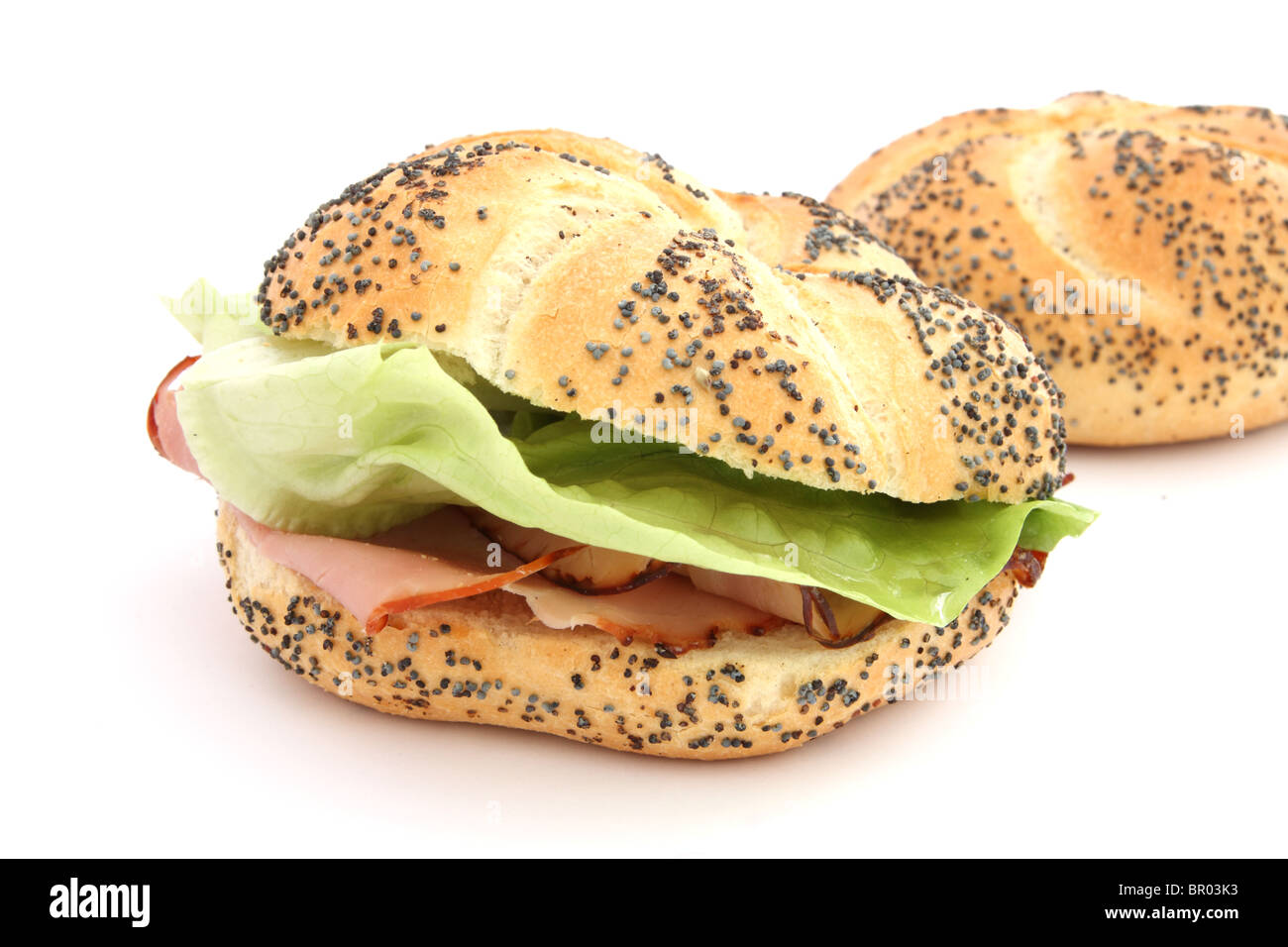 Sandwich made of bun with ham and lettuce on white background Stock ...