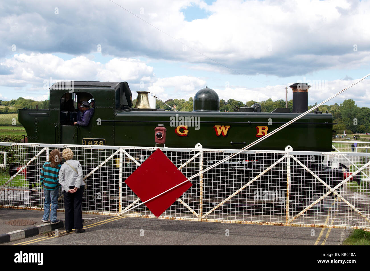 GWR pannier tank on the level crossing at Bodiam station on the Kent ...