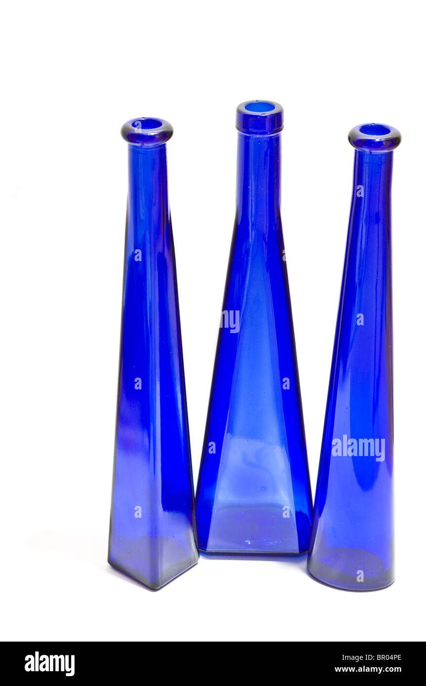 Three blue bottles standing Stock Photo - Alamy