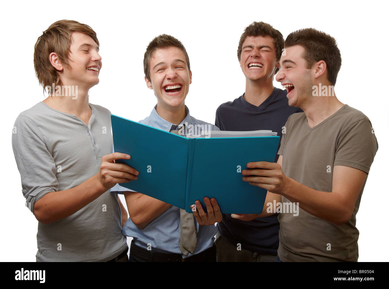Four young people working and having fun time together Stock Photo - Alamy